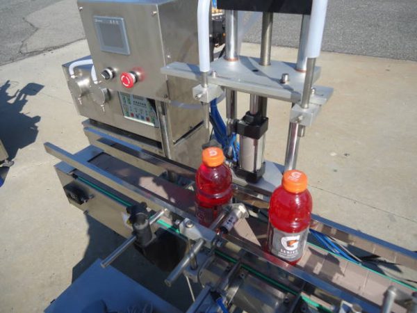 OCEAN PACKING TWO HEAD PUMP STYLE STAINLESS STEEL FILLING AND CAPPING ...