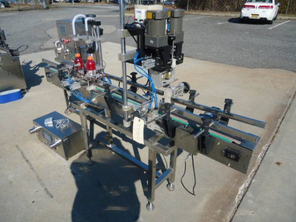 OCEAN PACKING TWO HEAD PUMP STYLE STAINLESS STEEL FILLING AND CAPPING ...